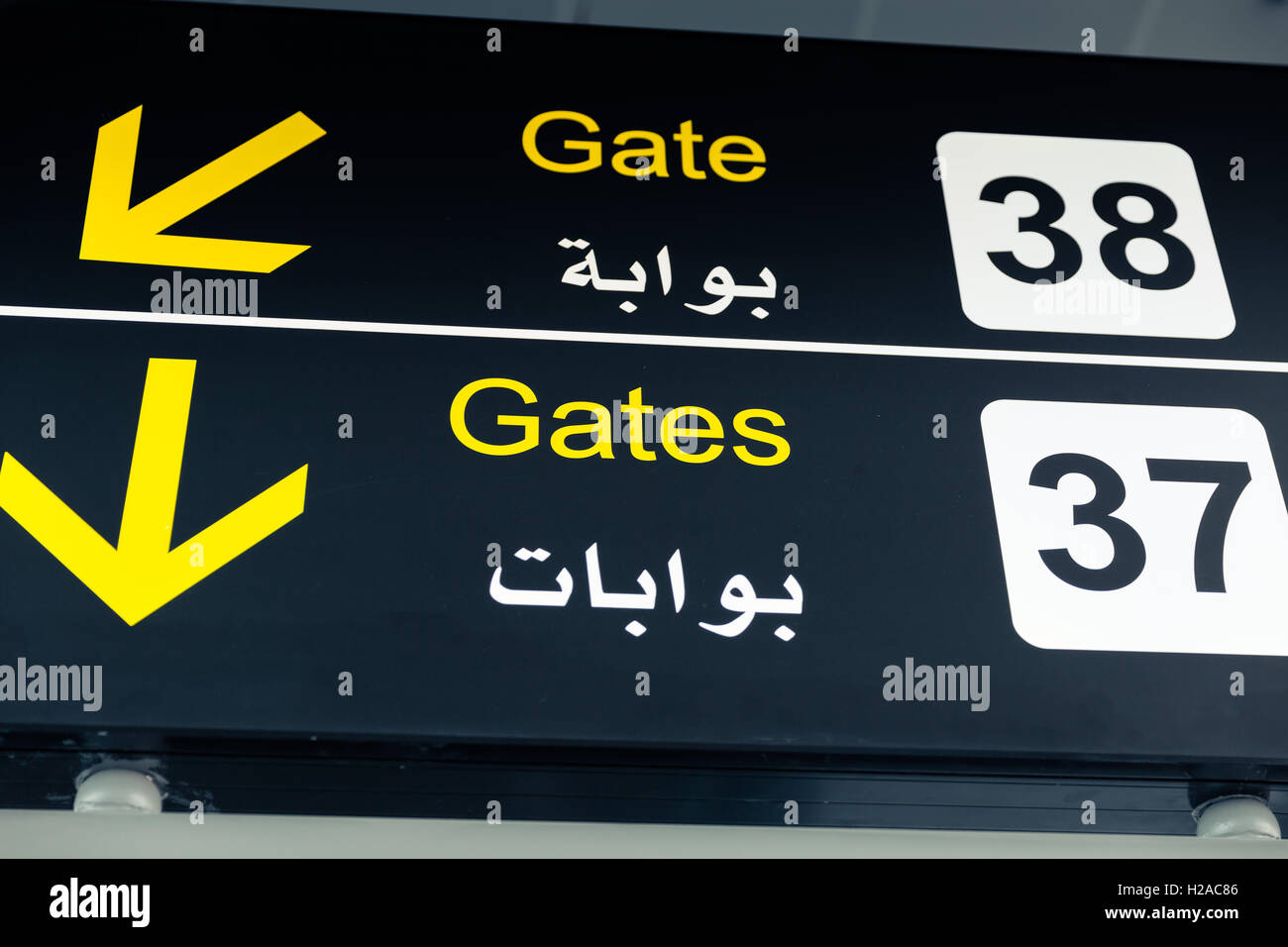 Black Airport Pointers - Gate direction Stock Photo - Alamy