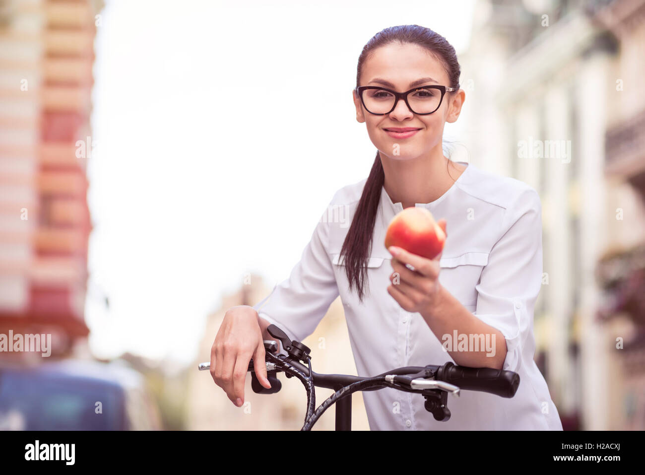 Delighted woman standing in the street Stock Photo - Alamy