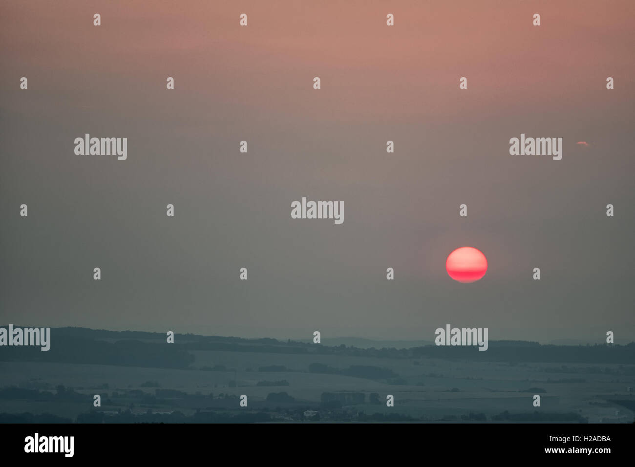 Blood-red sunset after a hot summer day Stock Photo - Alamy
