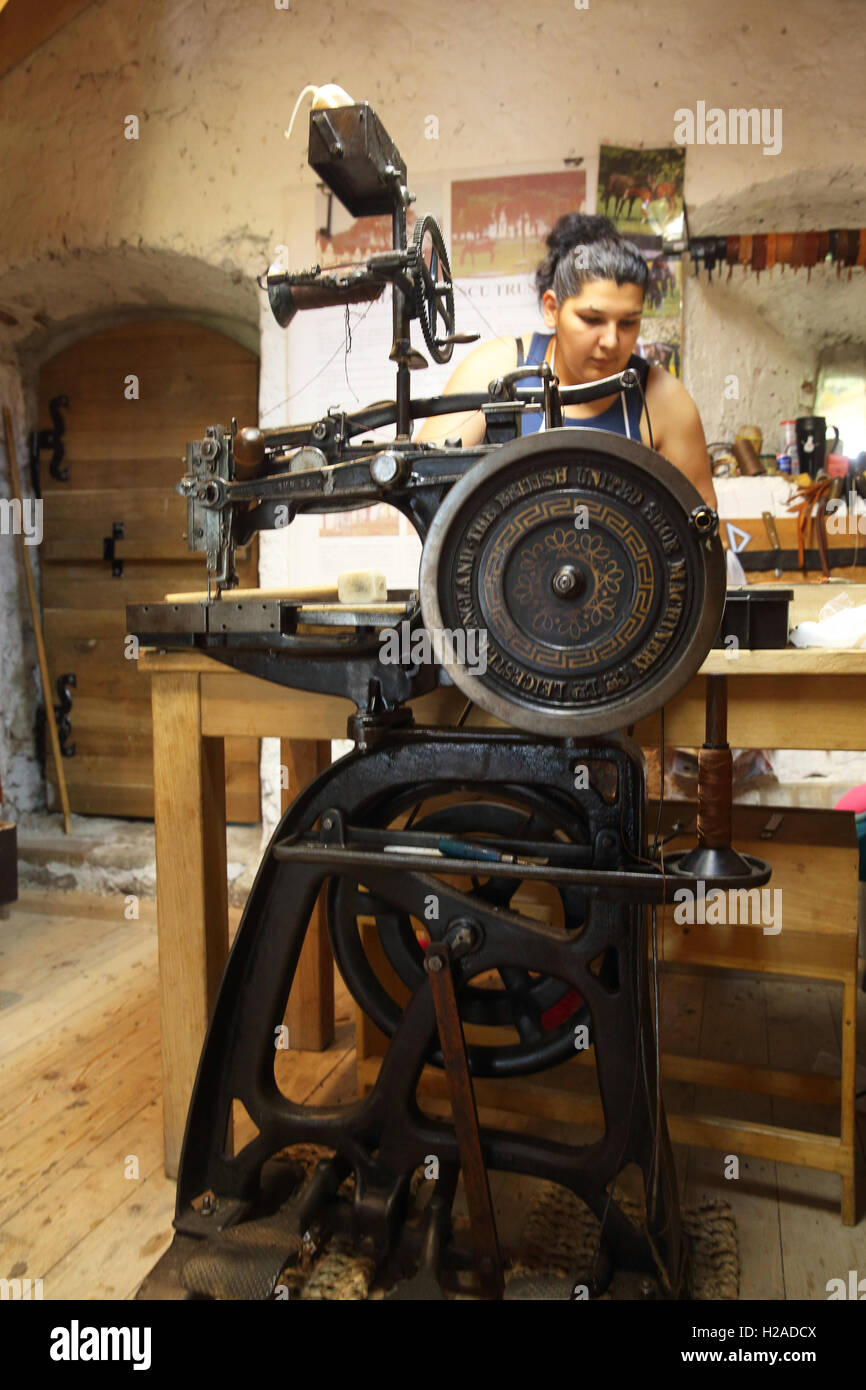 Lady making leather items to sell, in the medieval Furrier's Tower, in ...