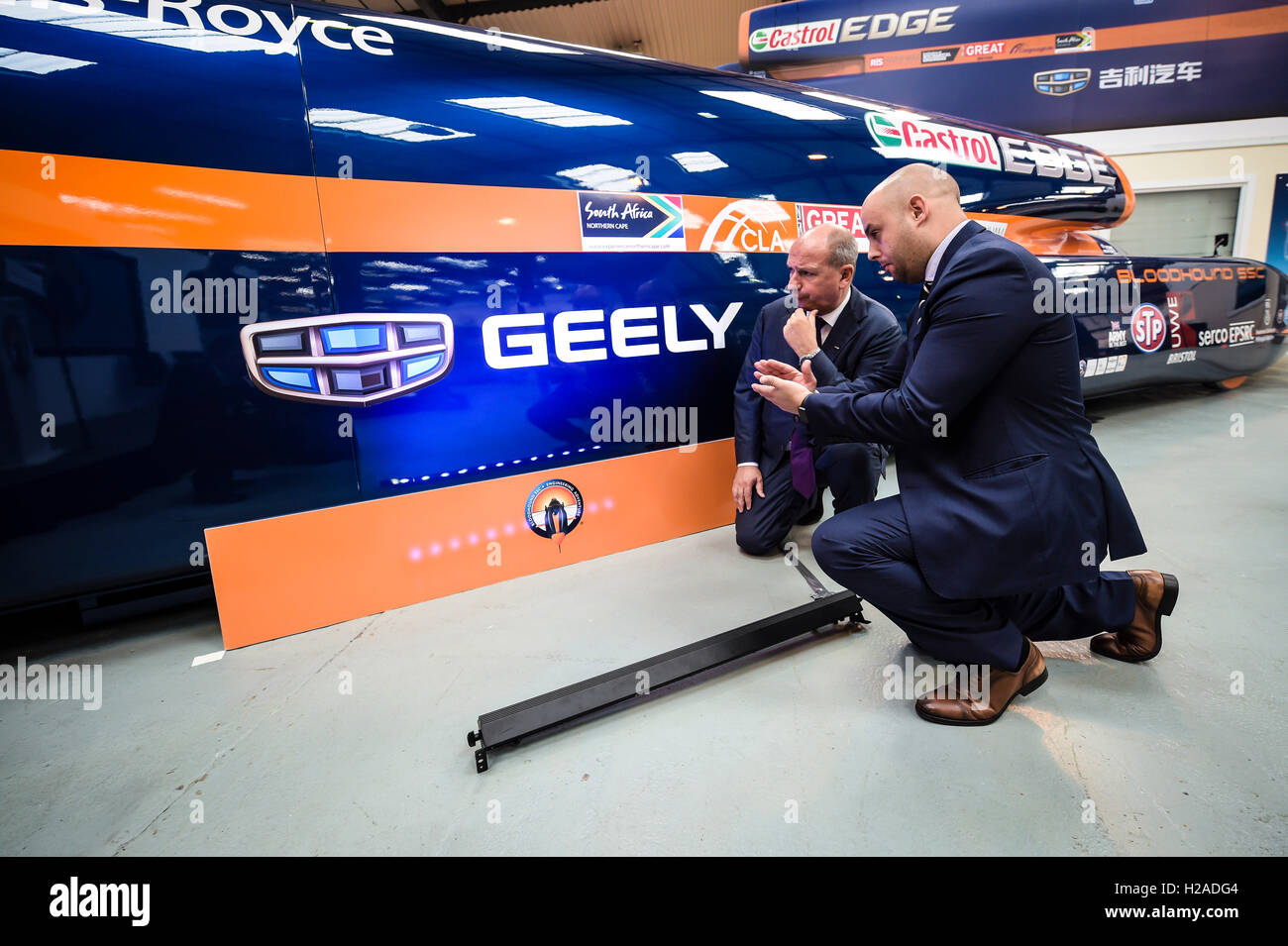 Staff from Chinese automotive firm Geely, Frank Klaas, Director of ...