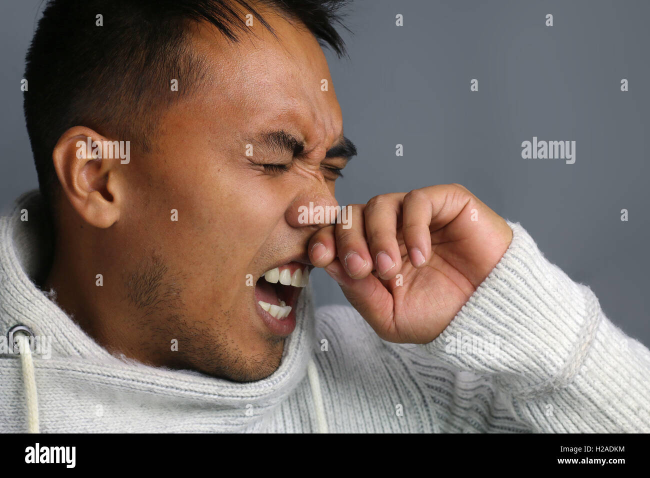 Sneezing young male hi-res stock photography and images - Alamy