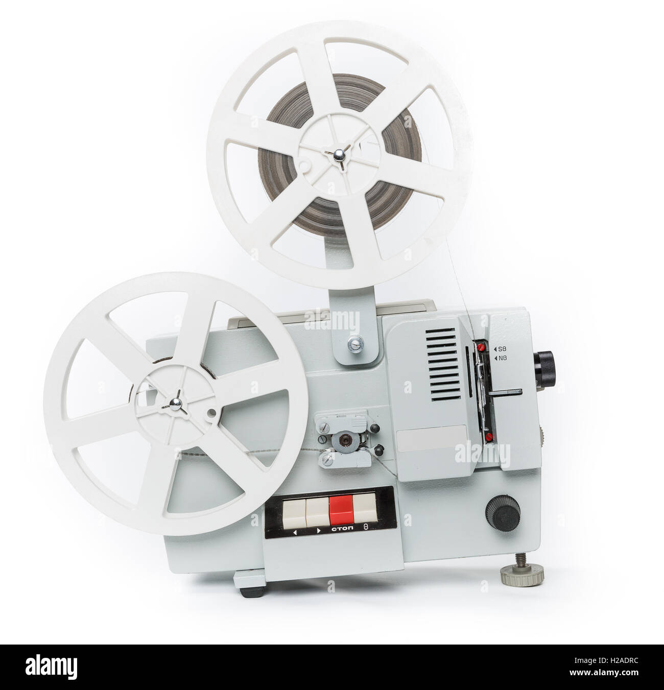 Old film projector isolated on a white background Stock Photo - Alamy