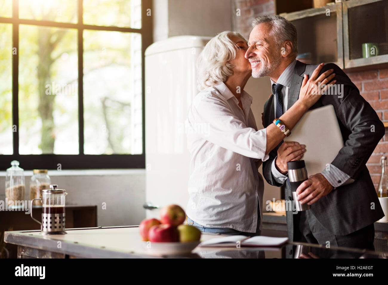 Morning in the kitchen of nice caring elderly couple Stock Photo - Alamy