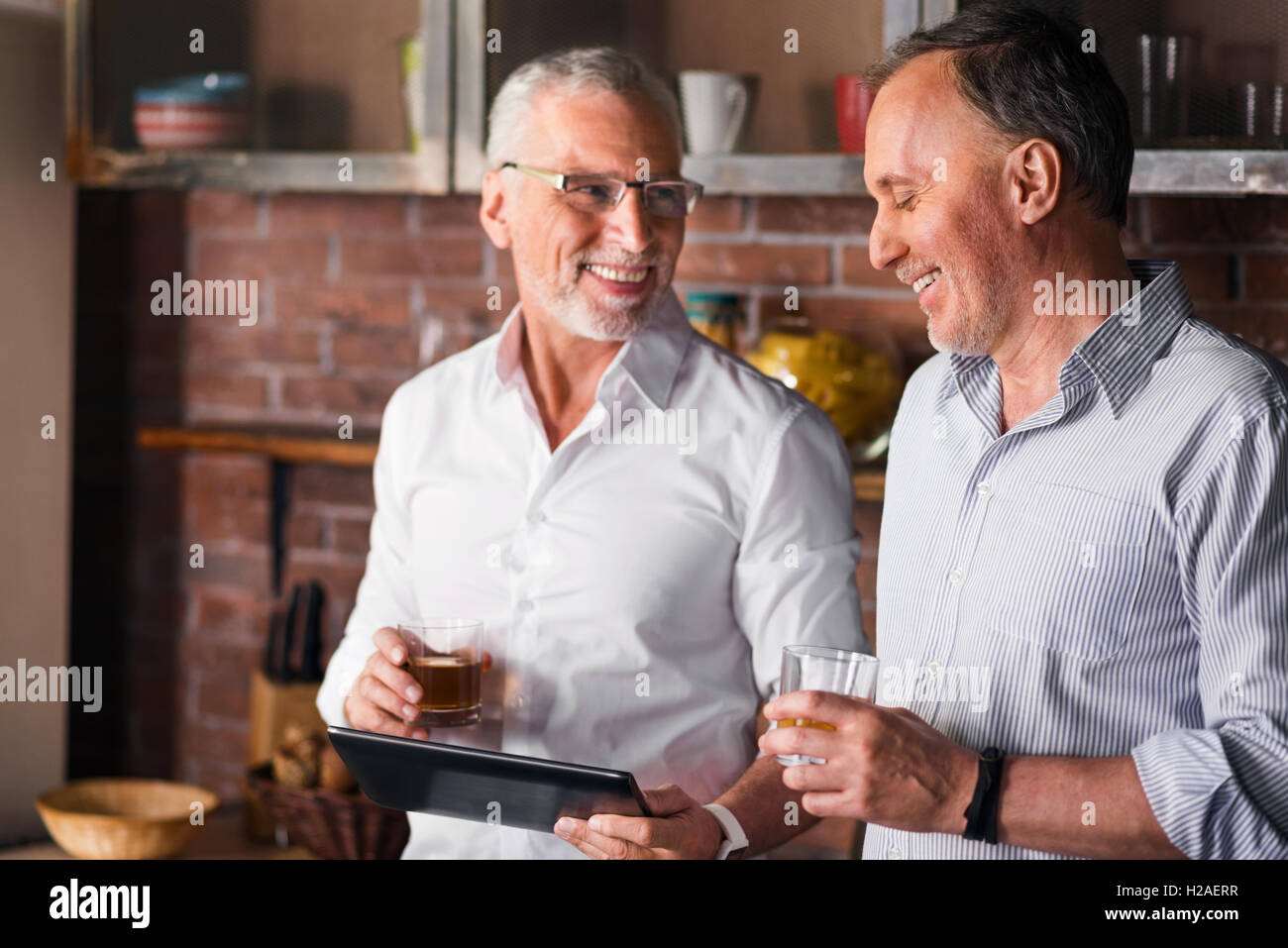 Two men talking at a party hi-res stock photography and images - Alamy