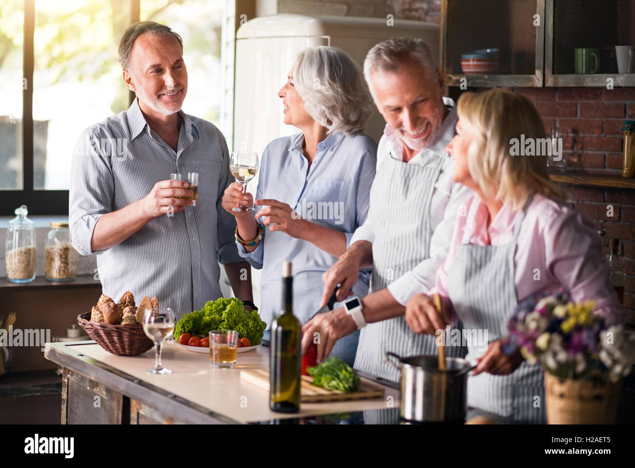Two aged families getting together for lunch Stock Photo - Alamy
