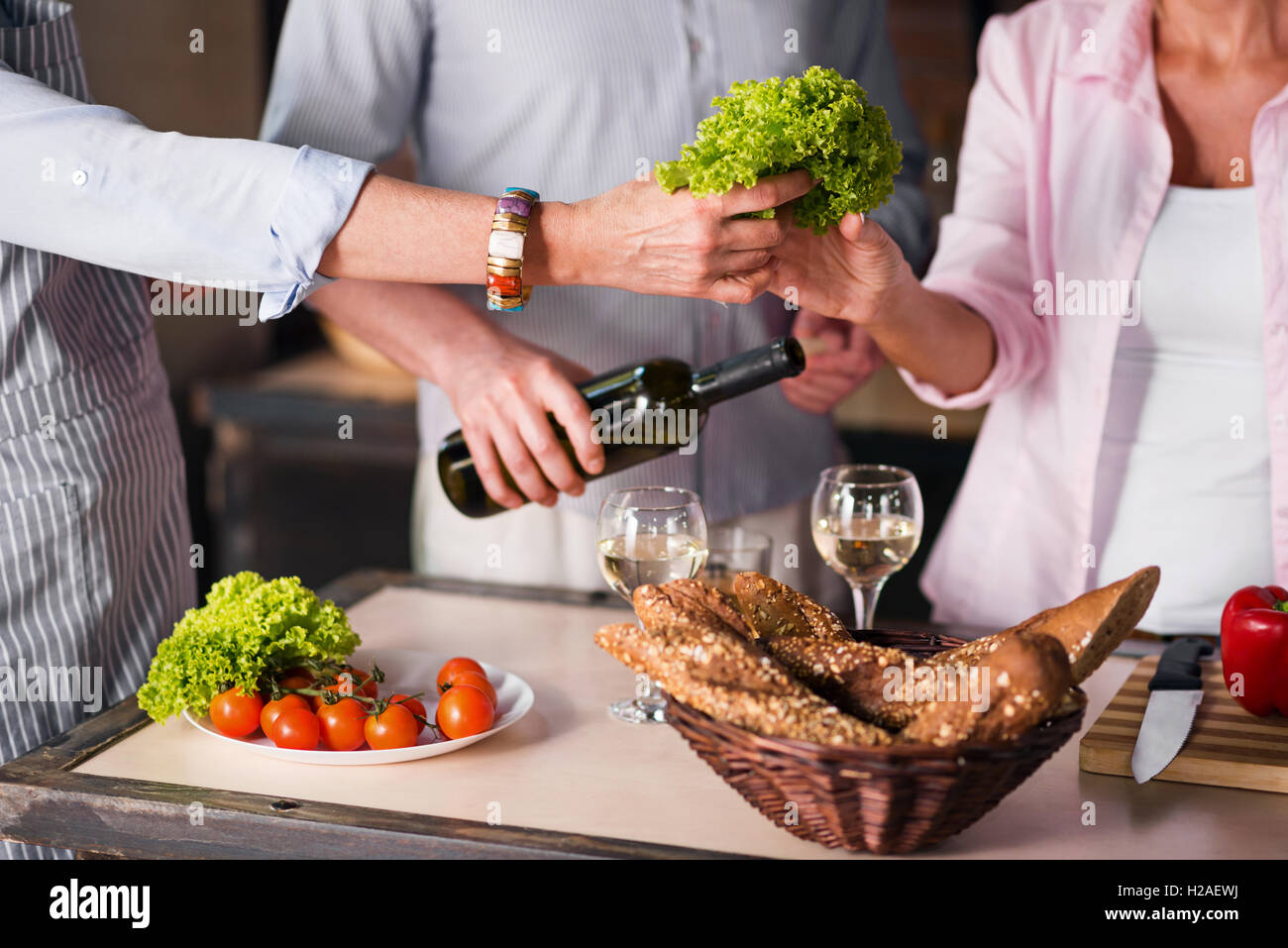 People cooking together healthy food in the kitchen at home Stock Photo ...