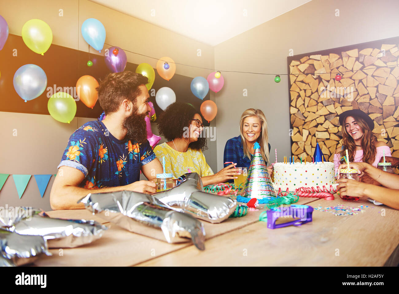 Group of four friends celebrating for a birthday party. Gifts, party ...