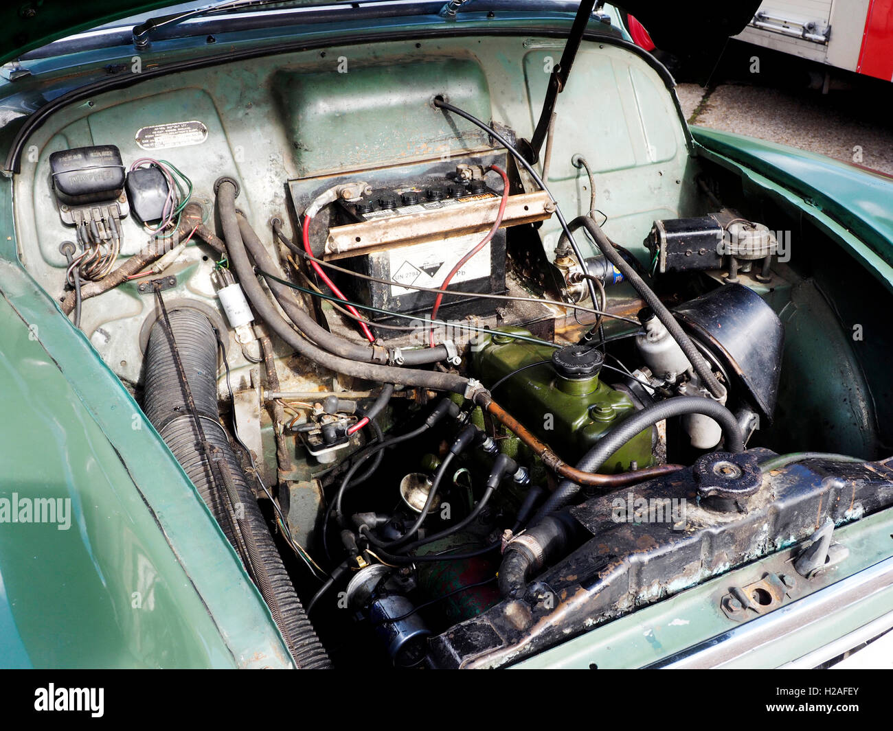 A late 1960's Morris 1000 saloon car with bonnet open showing the ...