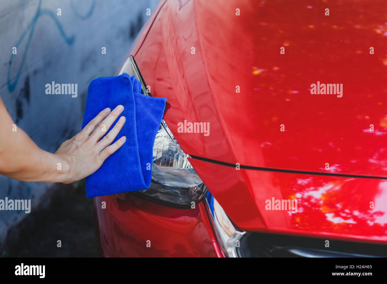 Young man washing and wiping a car in the outdoor Stock Photo - Alamy