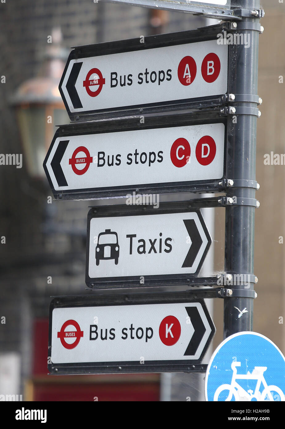 Bus stop and taxi signs in the City of London Stock Photo - Alamy