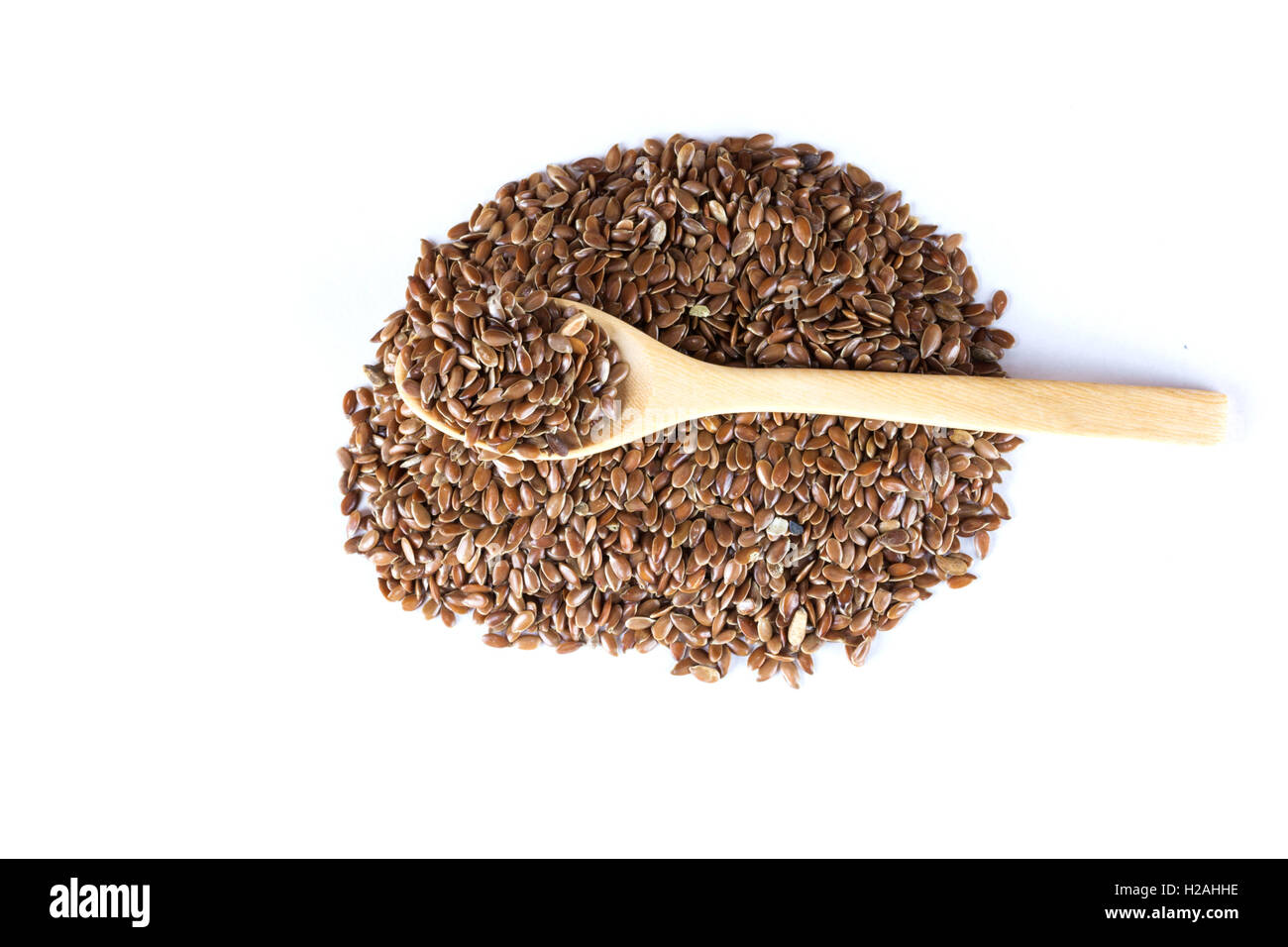 flax seed with spoon isolated on white background Stock Photo - Alamy