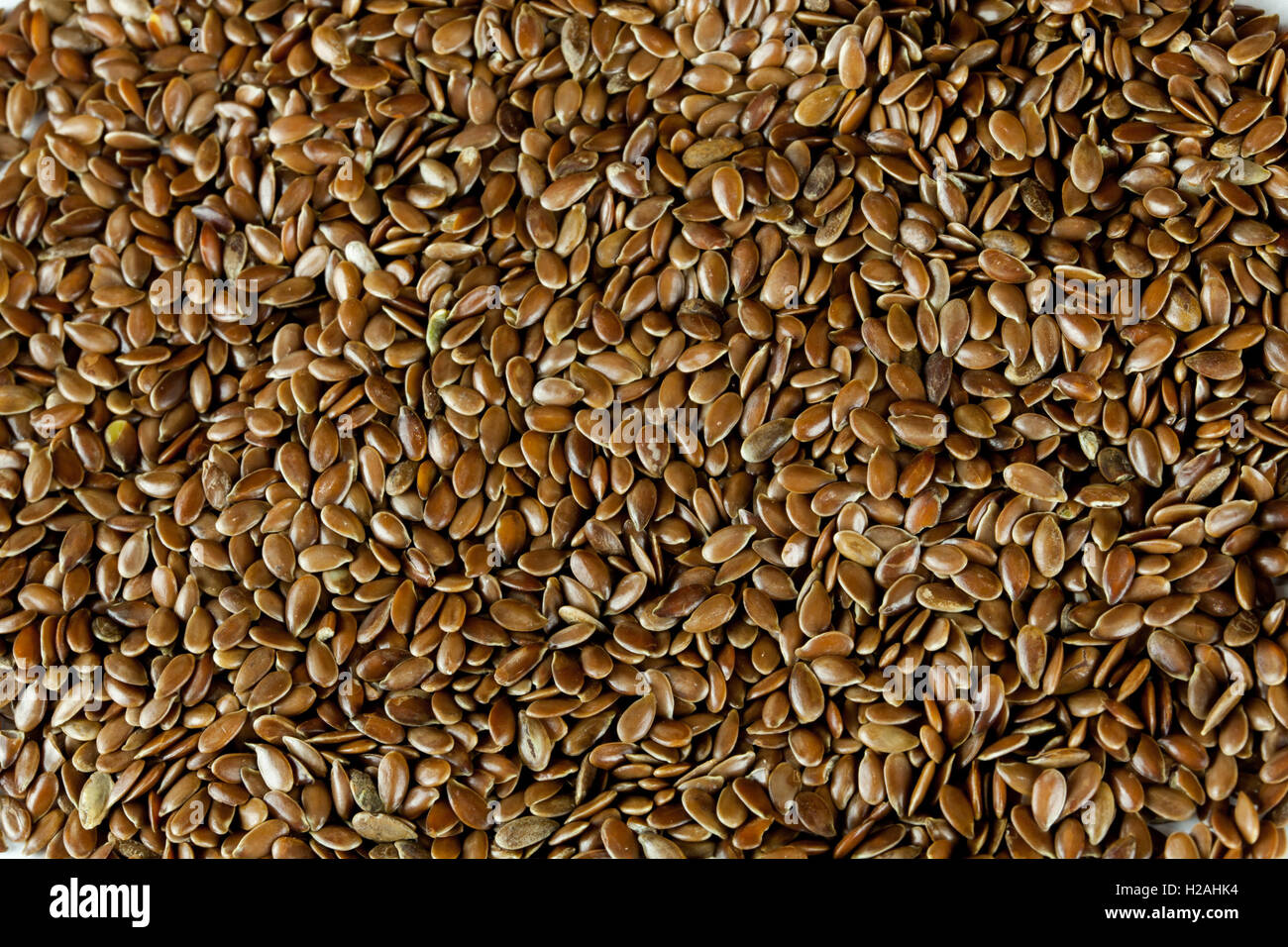flax seeds texture background abstract natural Stock Photo - Alamy