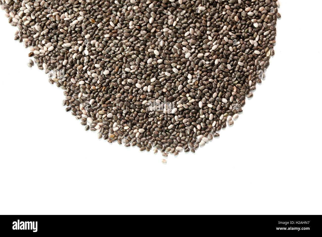 chia seeds on isolated white background Stock Photo - Alamy
