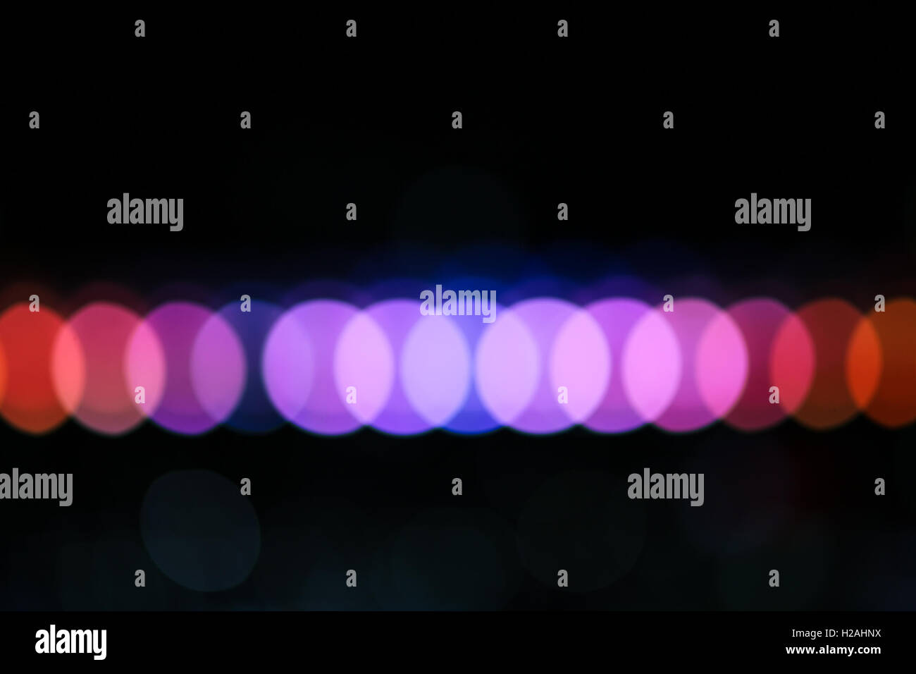 Straight lines of colourful bokeh for background Stock Photo - Alamy