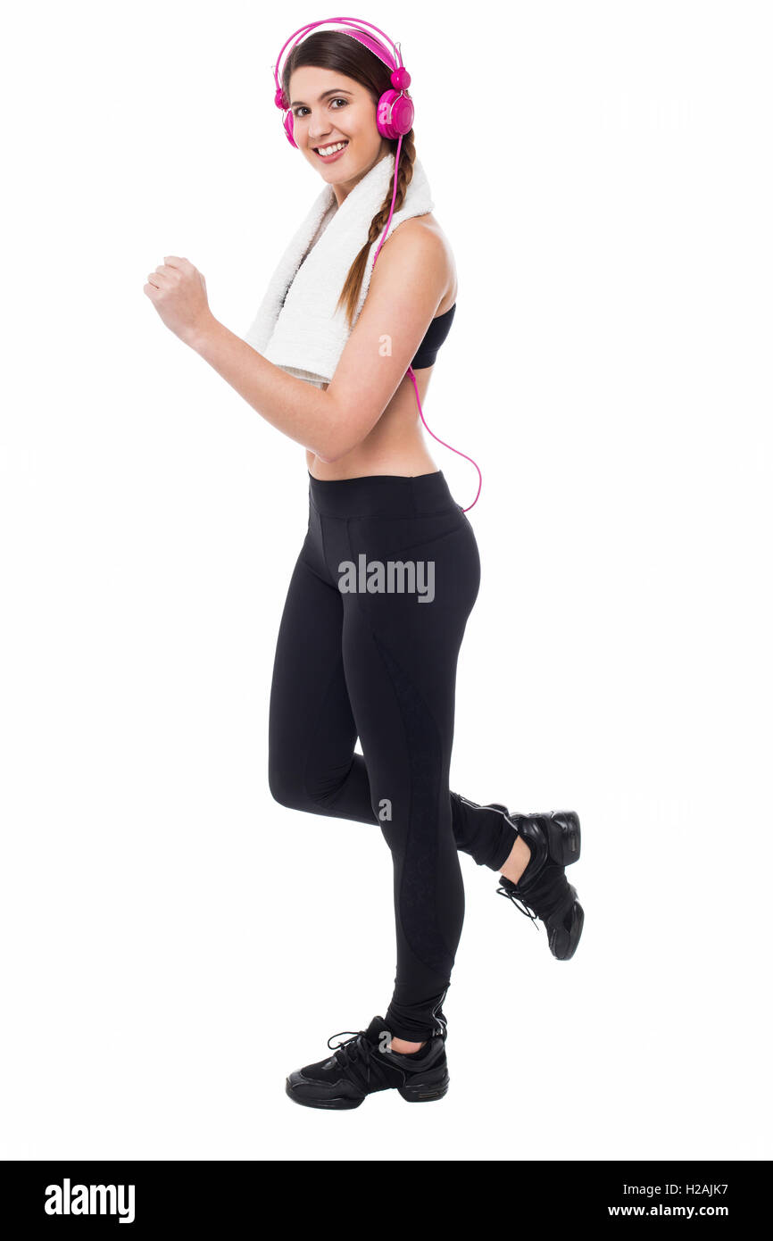 Woman enjoying music while exercising Stock Photo - Alamy