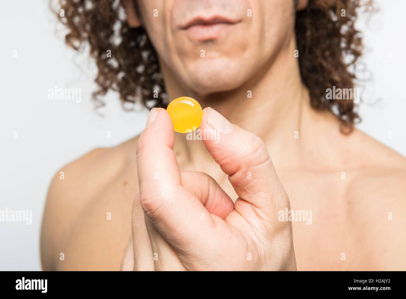 Man holding pill strong hi-res stock photography and images - Alamy