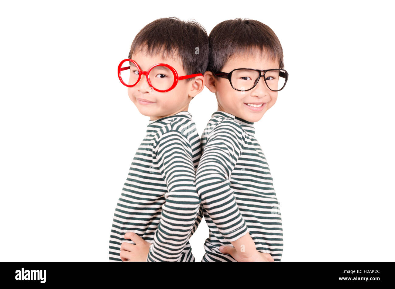 Two brother smiling on white background Stock Photo - Alamy