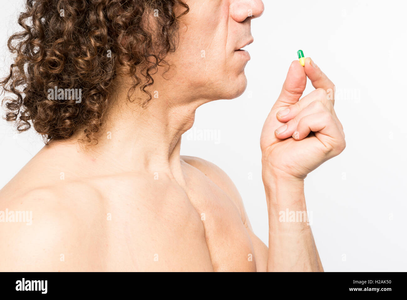 Man holding pill strong hi-res stock photography and images - Alamy