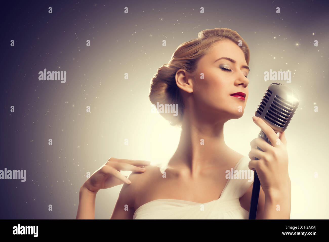 attractive female singer with microphone Stock Photo - Alamy