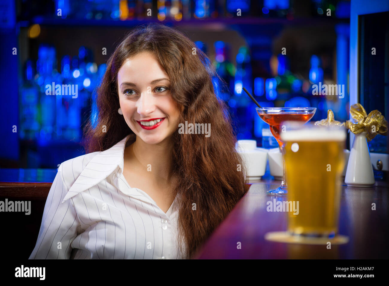 young woman in a bar Stock Photo - Alamy