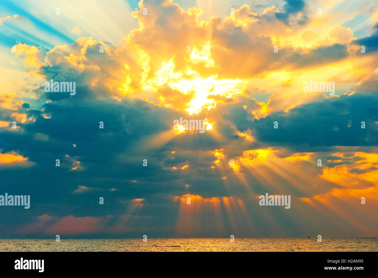 golden rays of the sun breaking through the storm clouds Stock Photo - Alamy