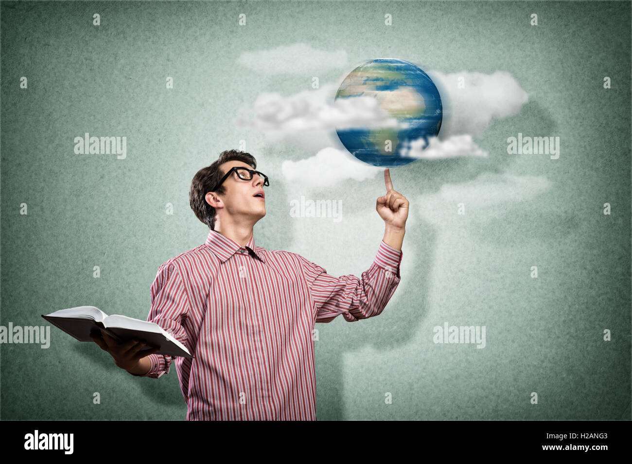 young man with a book thinks Stock Photo - Alamy