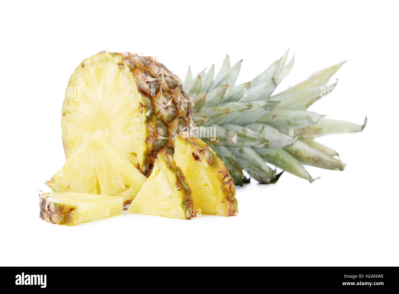 Pineapple with quarter slices Stock Photo - Alamy