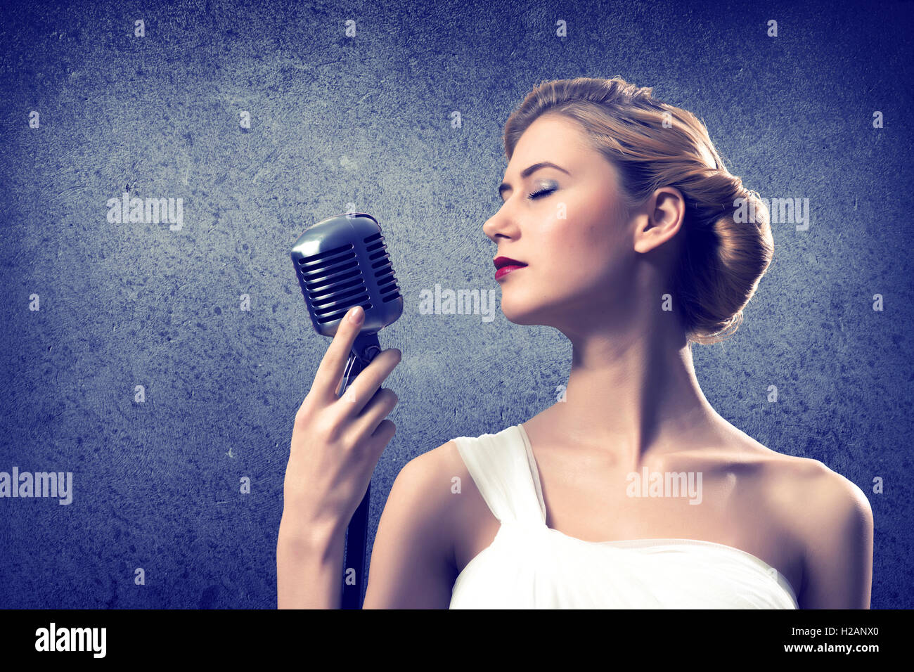 attractive female singer with microphone Stock Photo - Alamy
