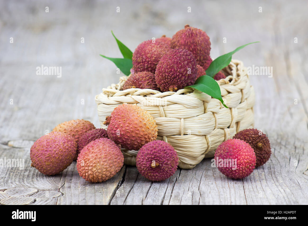 fresh lychees in a basket Stock Photo - Alamy