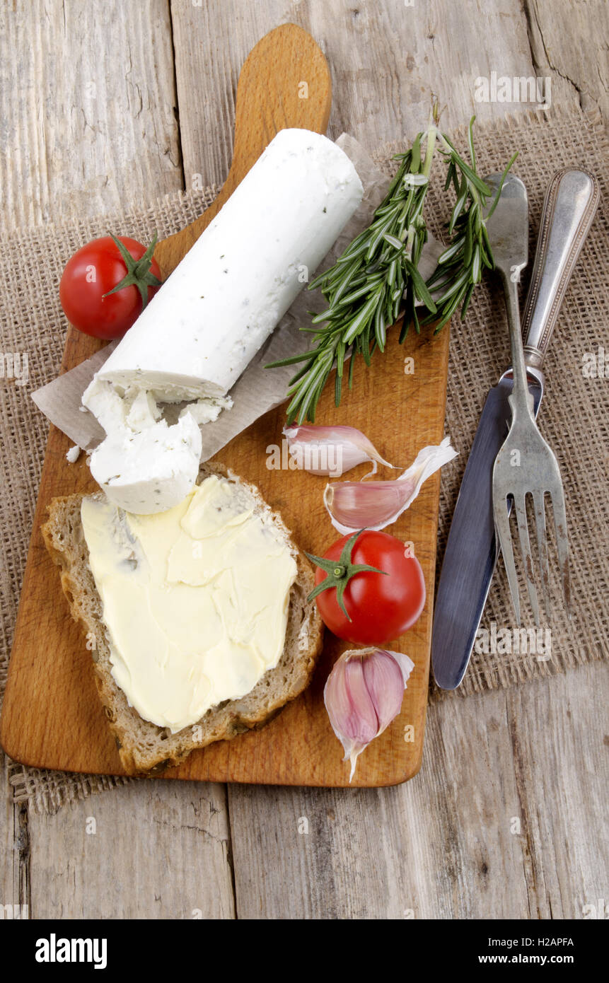 soft goat cheese with garlic and herb Stock Photo - Alamy