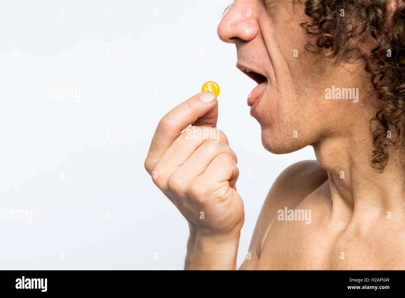 Man holding pill strong hi-res stock photography and images - Alamy