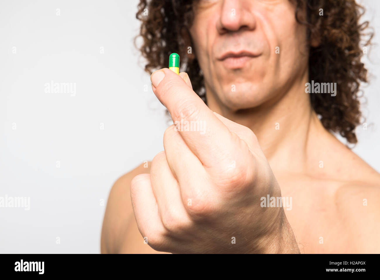 Man holding pill strong hi-res stock photography and images - Alamy