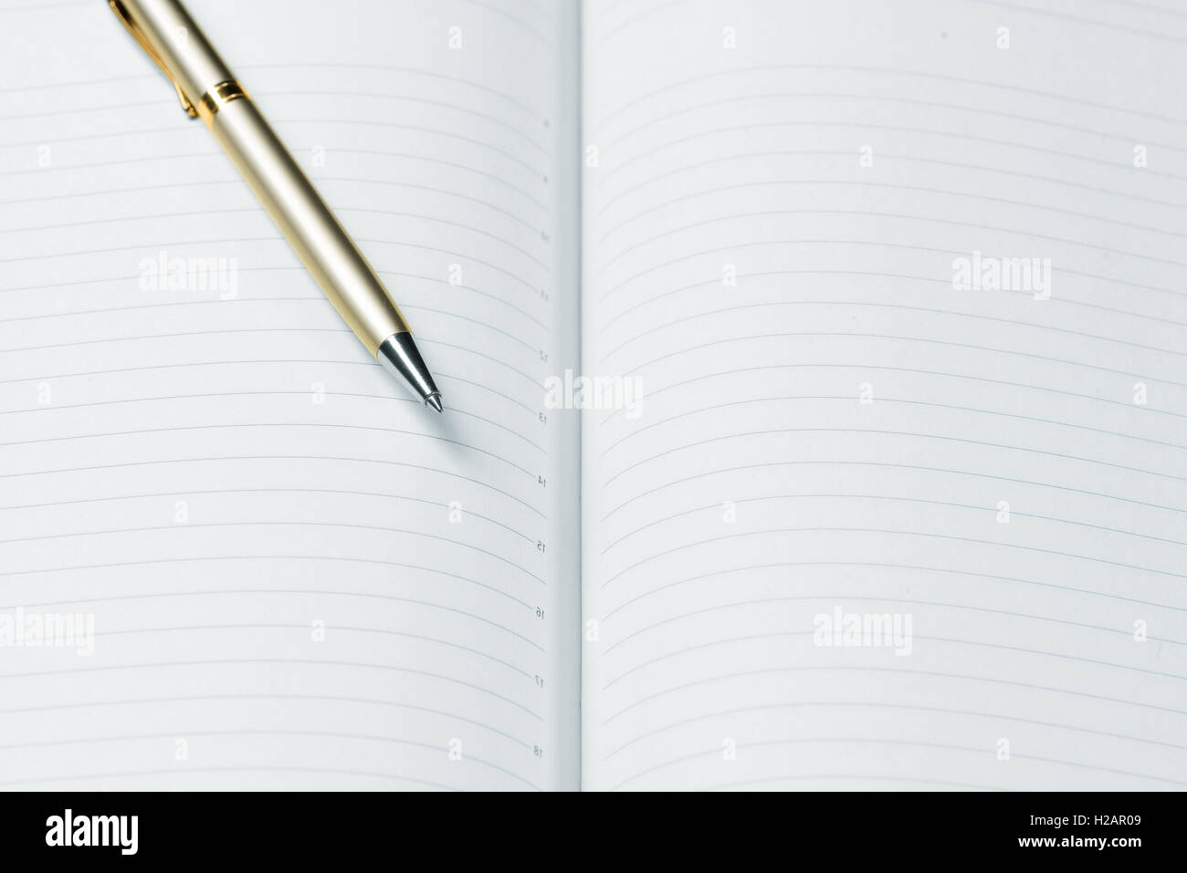 pen and open notepad Stock Photo - Alamy