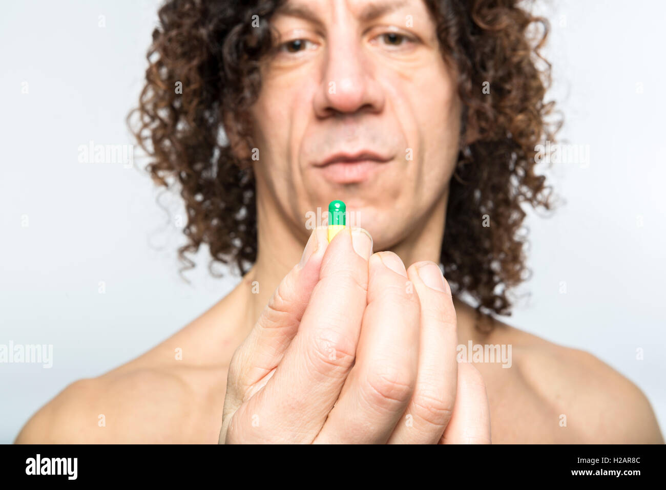 Man taking pill Stock Photo - Alamy