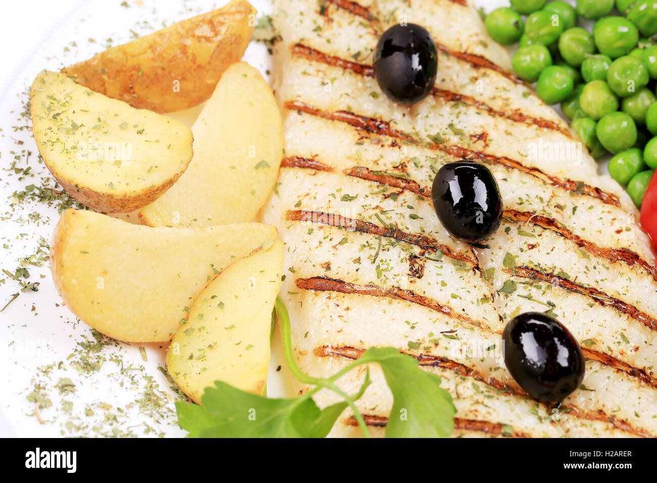 Fried fish fillet with vegetables Stock Photo - Alamy