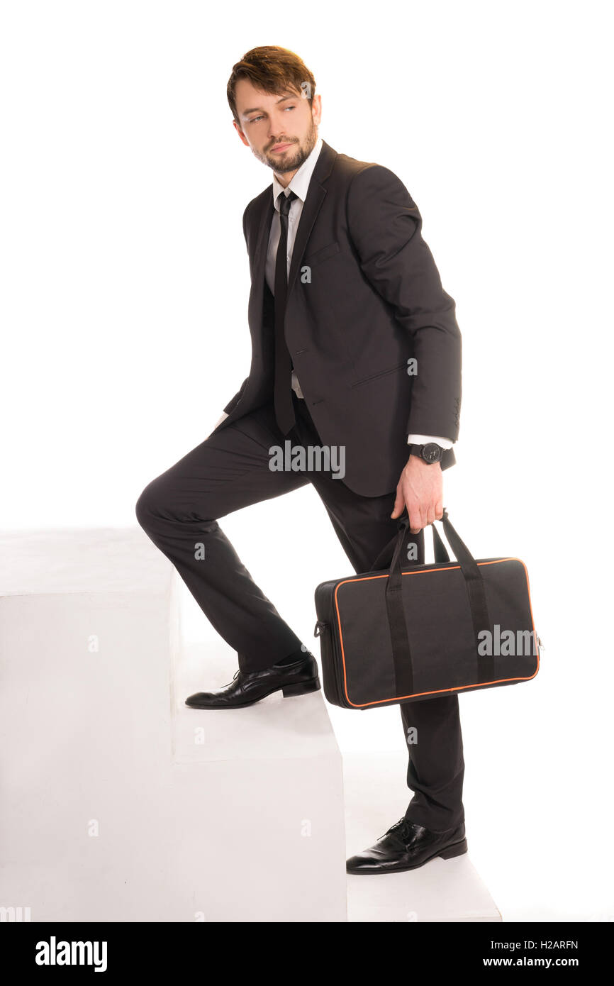Businessman climbing stairs with a briefcase Stock Photo - Alamy