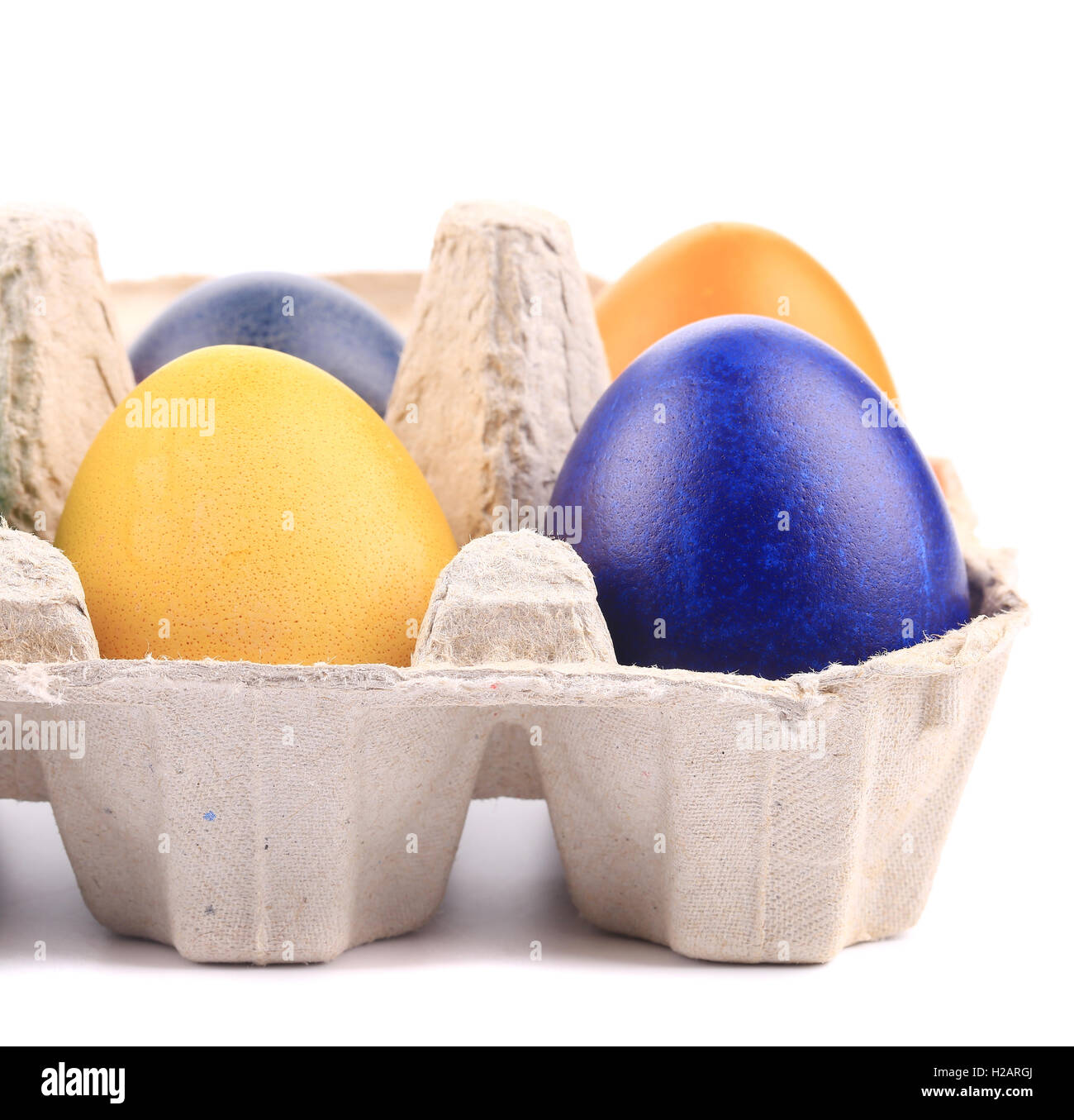 Cardboard egg box with Easter colored eggs Stock Photo - Alamy