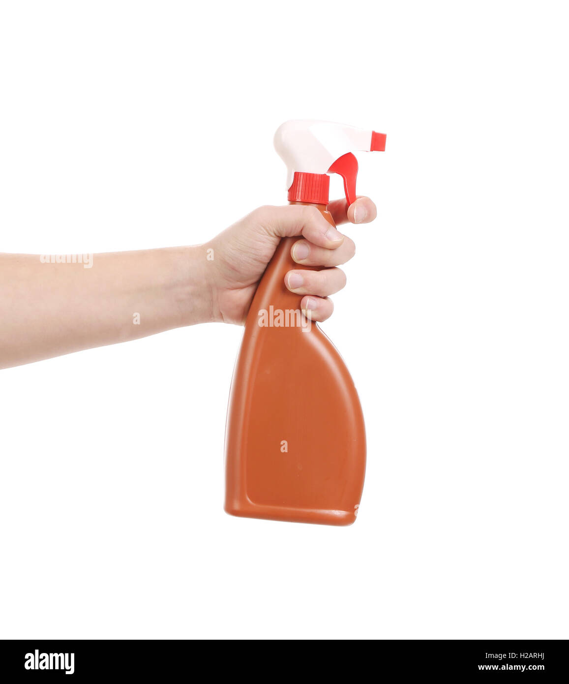 Hand holding brown plastic spray bottle Stock Photo - Alamy