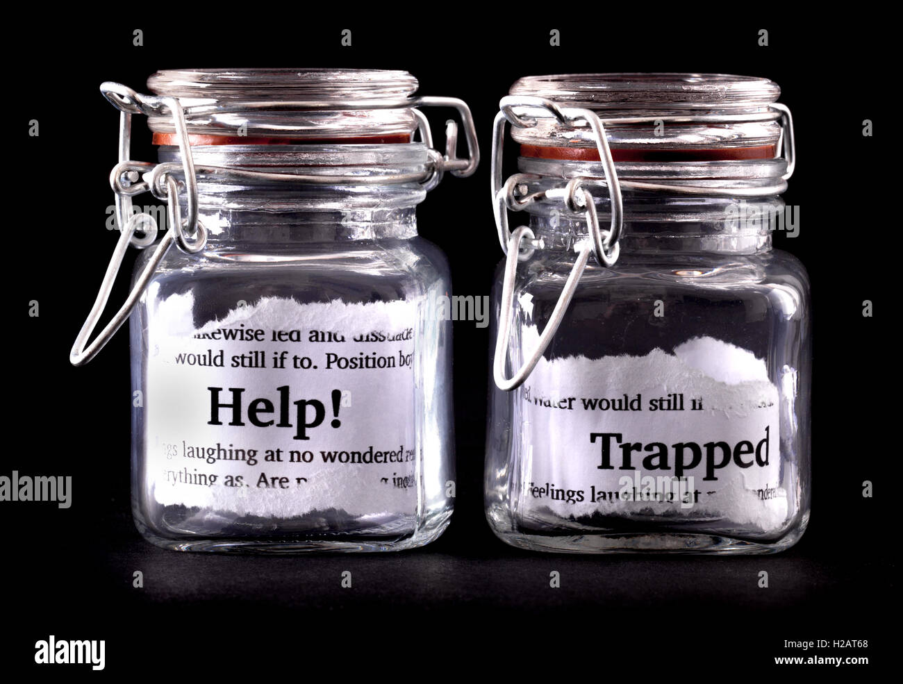 Trapped concept jars Stock Photo - Alamy