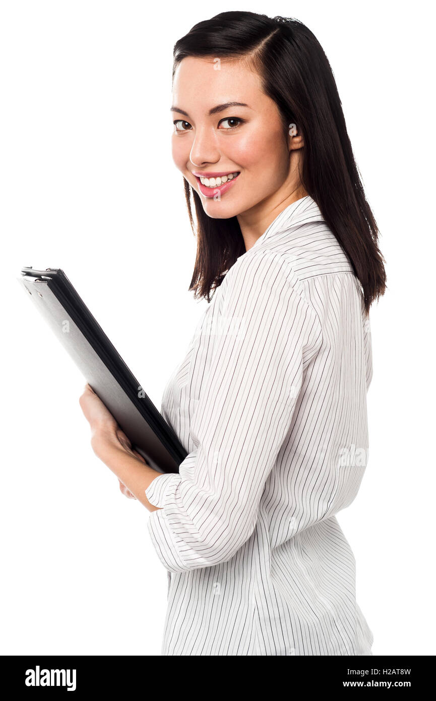 Female assistant holding business files Stock Photo - Alamy
