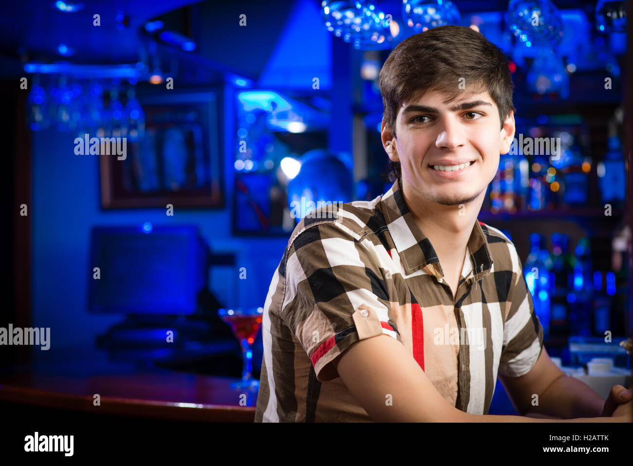 portrait of a young man at the bar Stock Photo - Alamy
