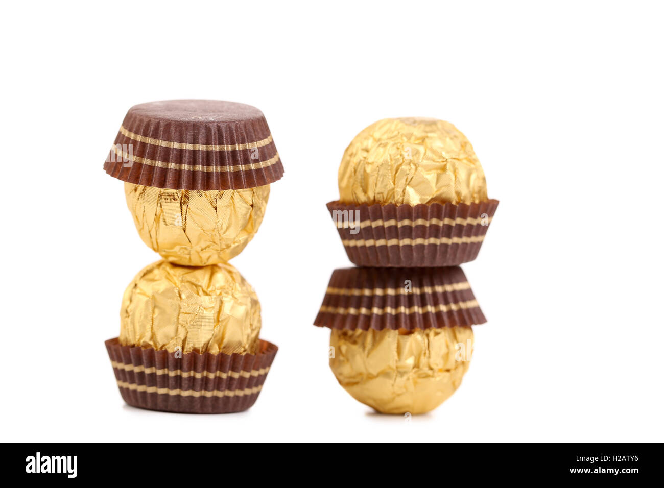 Two stacks of chocolate bonbons Stock Photo - Alamy