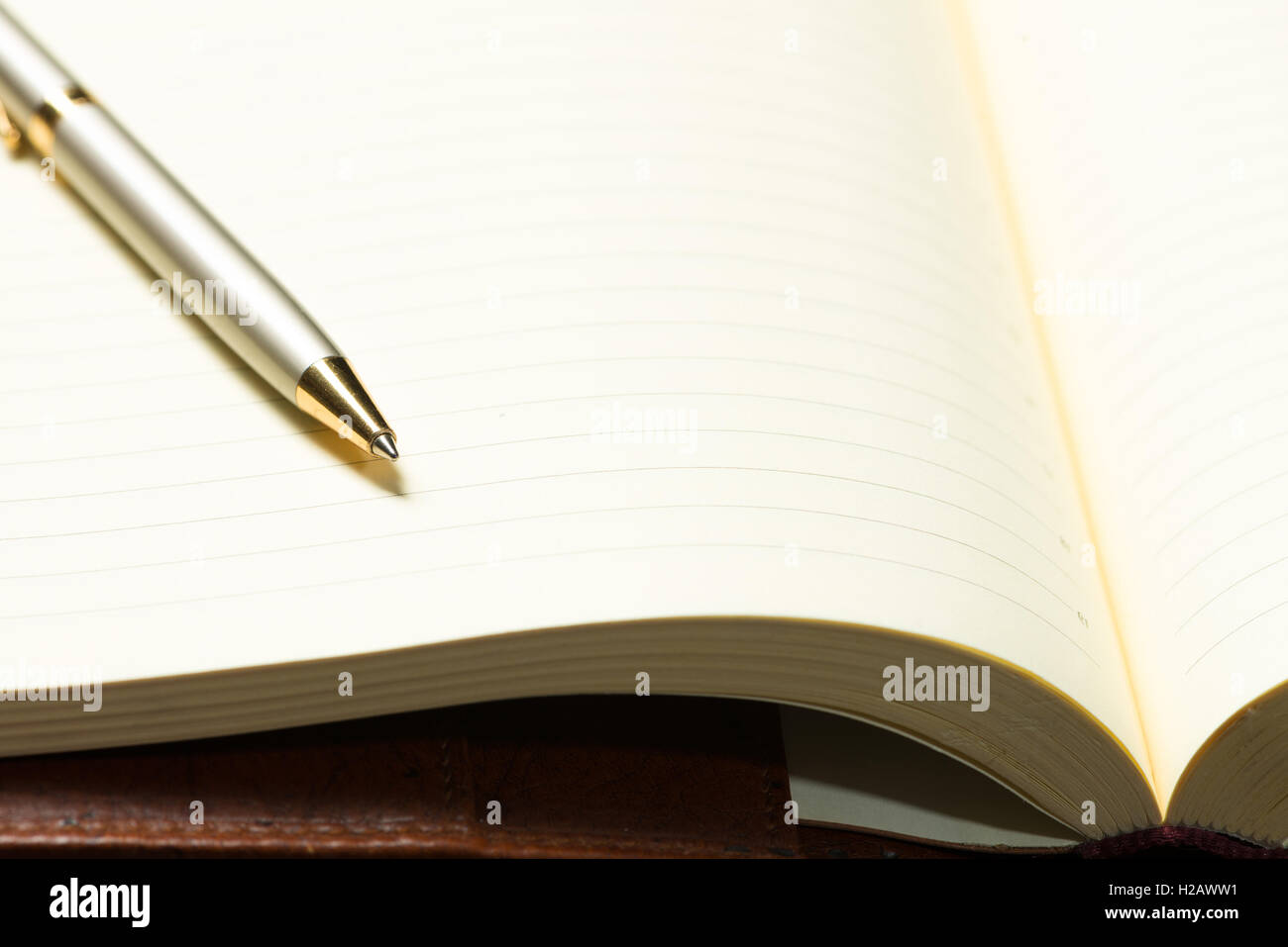 pen and open notepad Stock Photo - Alamy