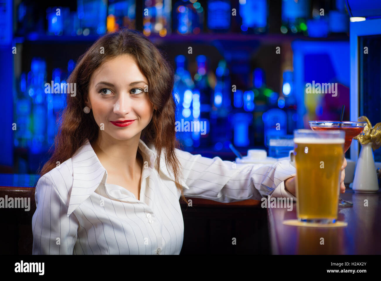 young woman in a bar Stock Photo - Alamy
