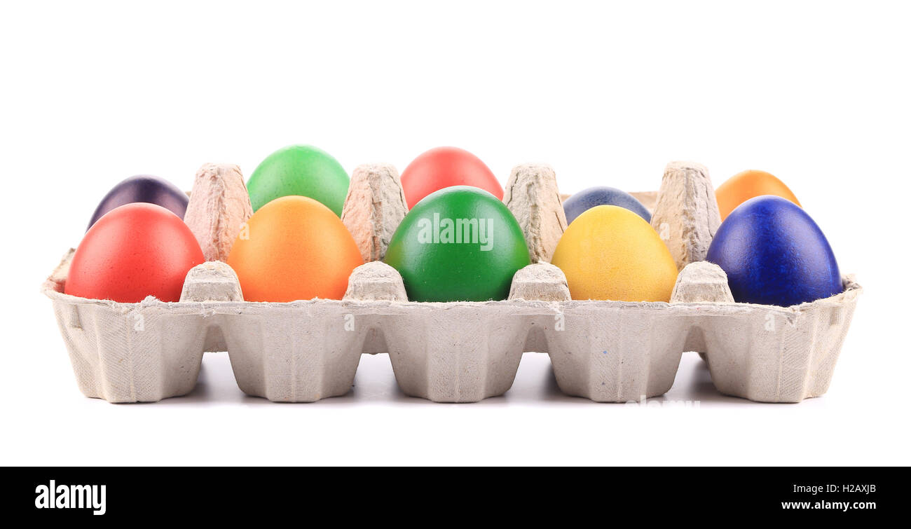 Cardboard egg box with Easter colored eggs Stock Photo - Alamy