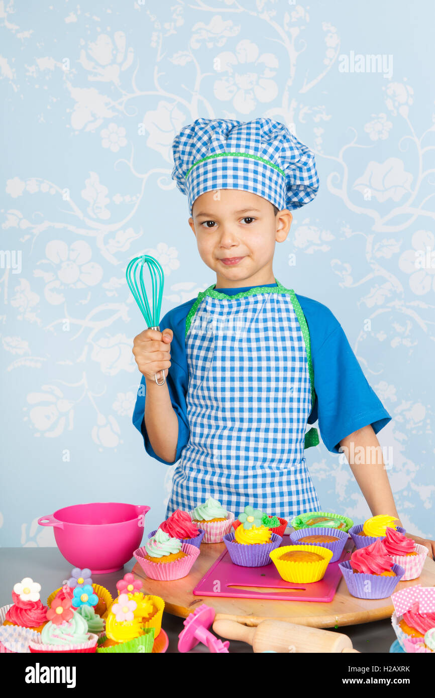Little boy baking cupcakes Stock Photo - Alamy