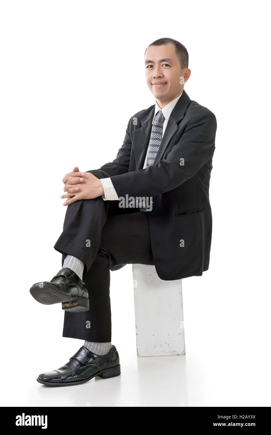 Friendly Asian business man sit Stock Photo - Alamy