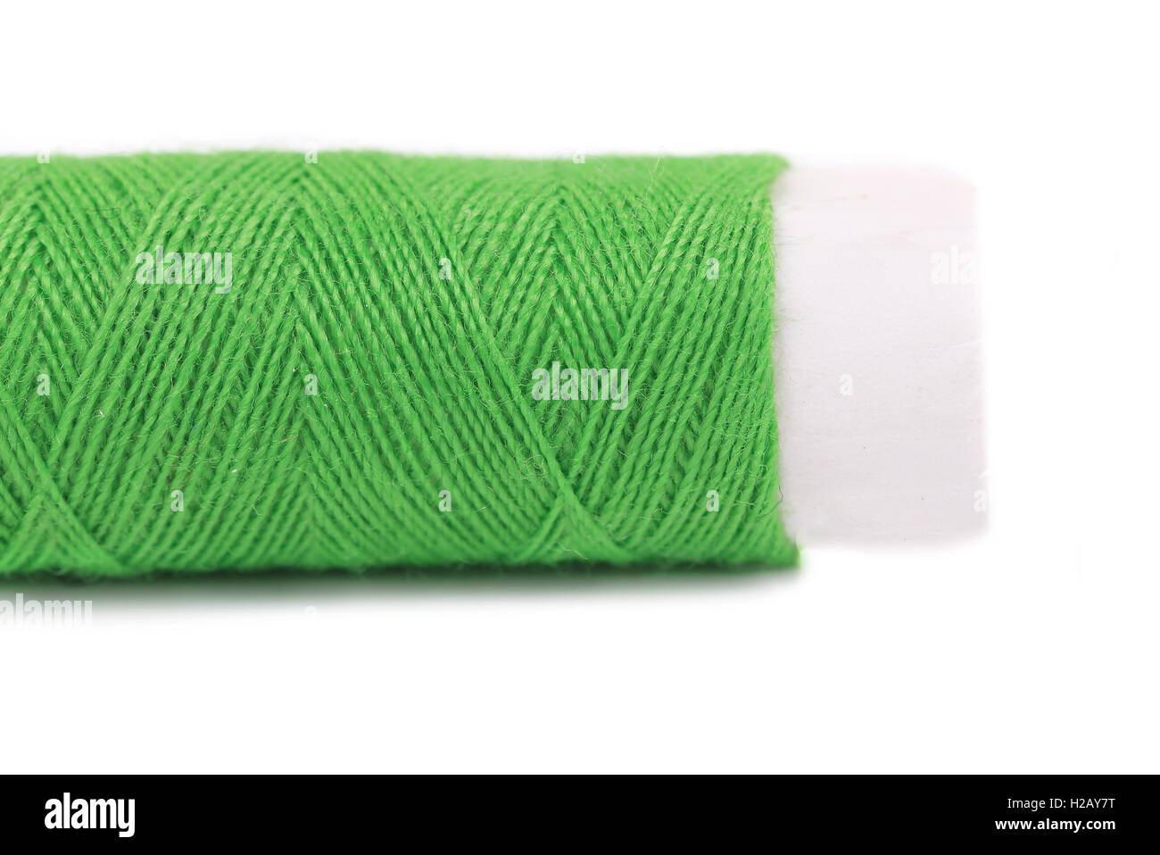 background green Sewing thread Stock Photo - Alamy