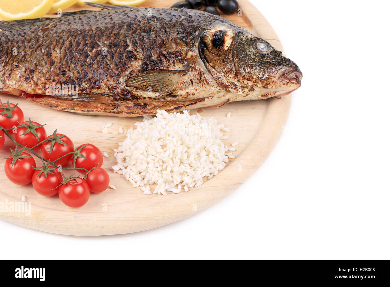 Fried fish with rice and vegetables Stock Photo - Alamy